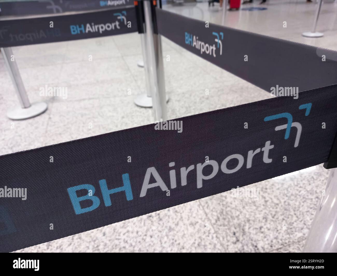 Minas Gerais, Brazil - January 23, 2025: Detail of retractable tape with brand from BH Airport ...