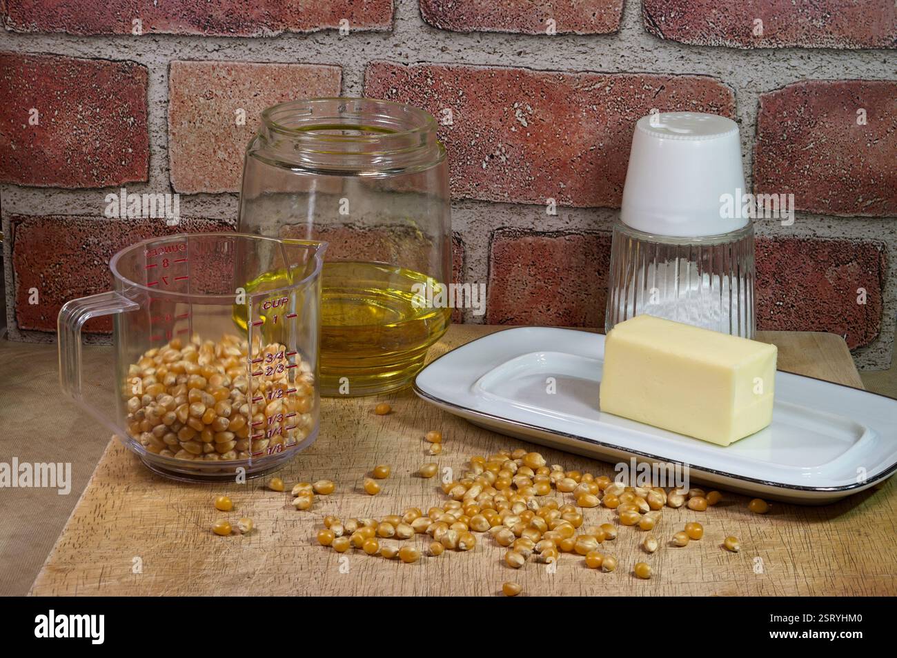 Kitchen scene with butter, salt, oil and popcorn Stock Photo - Alamy