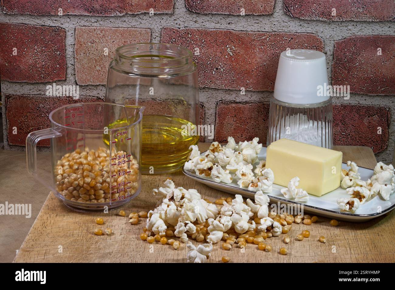 Kitchen scene with butter, popped popcorn, kernels, oil and salt Stock ...