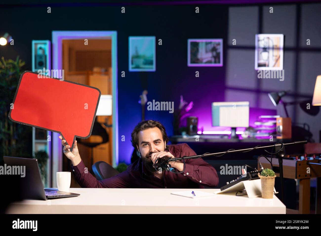 Man filming sponsored content, holding empty copy space sign, following ...