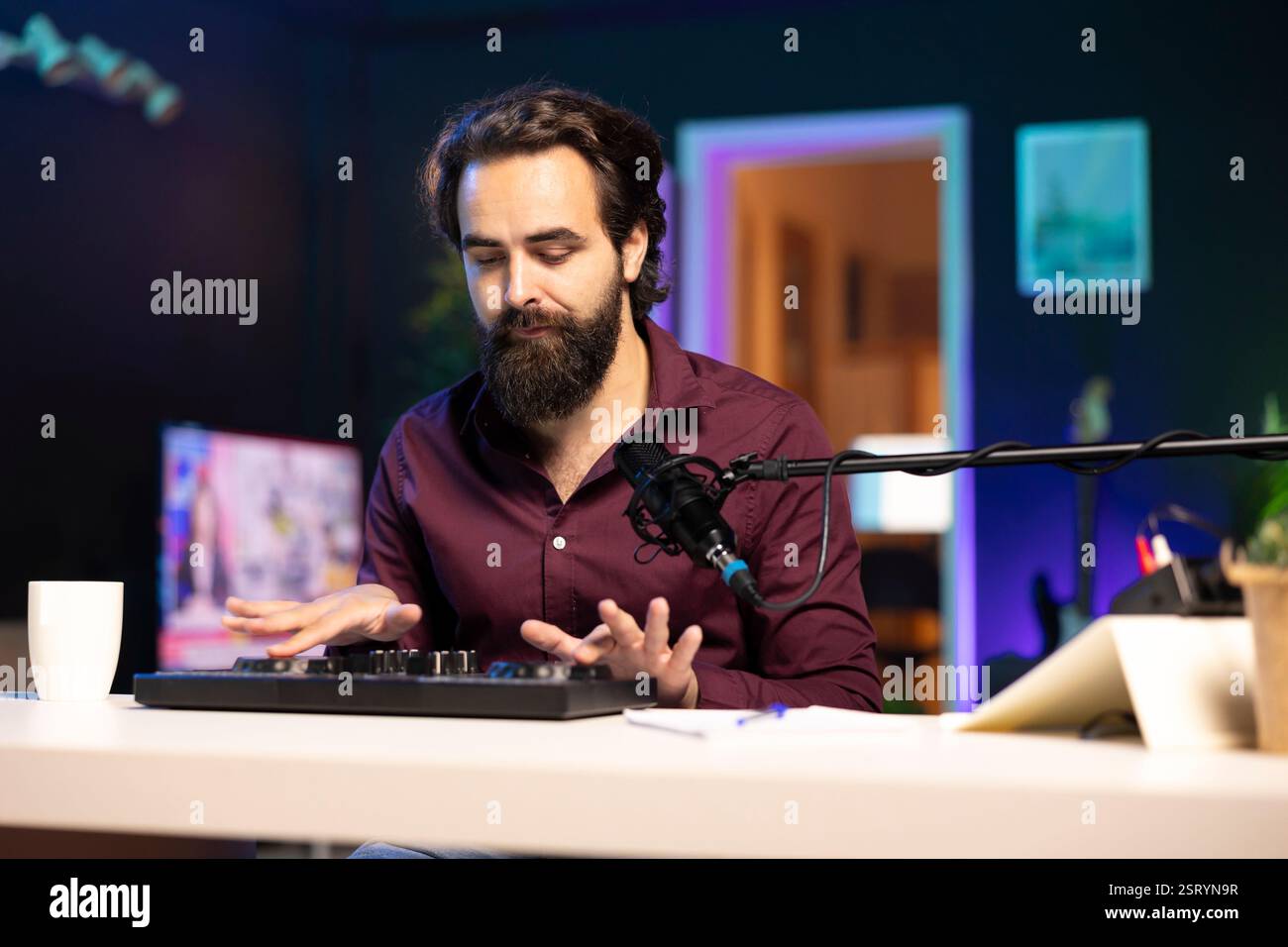 Artist filming DJ mixing tutorial, showing examples of sampling on ...