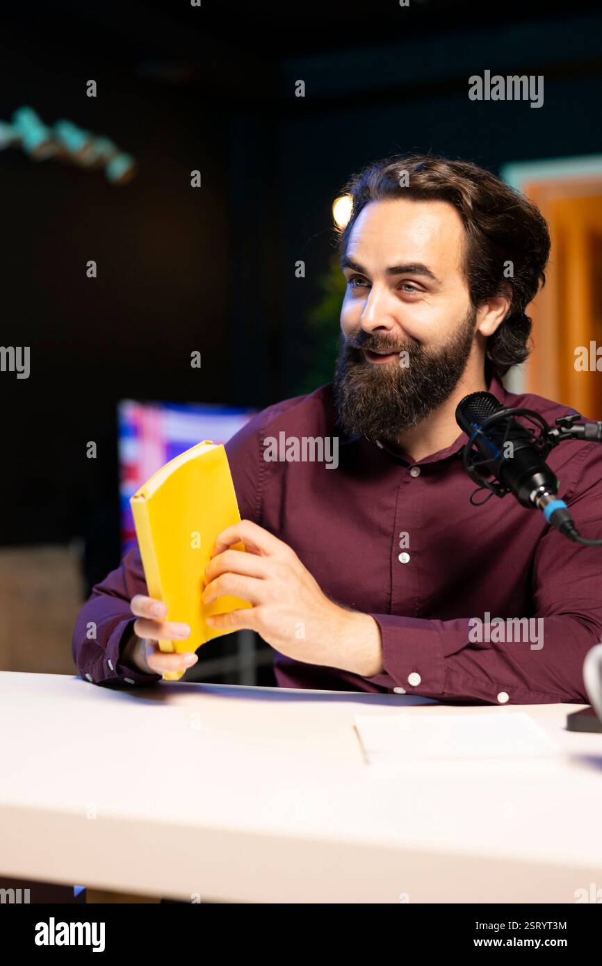 Internet show host using professional microphone to film content about ...