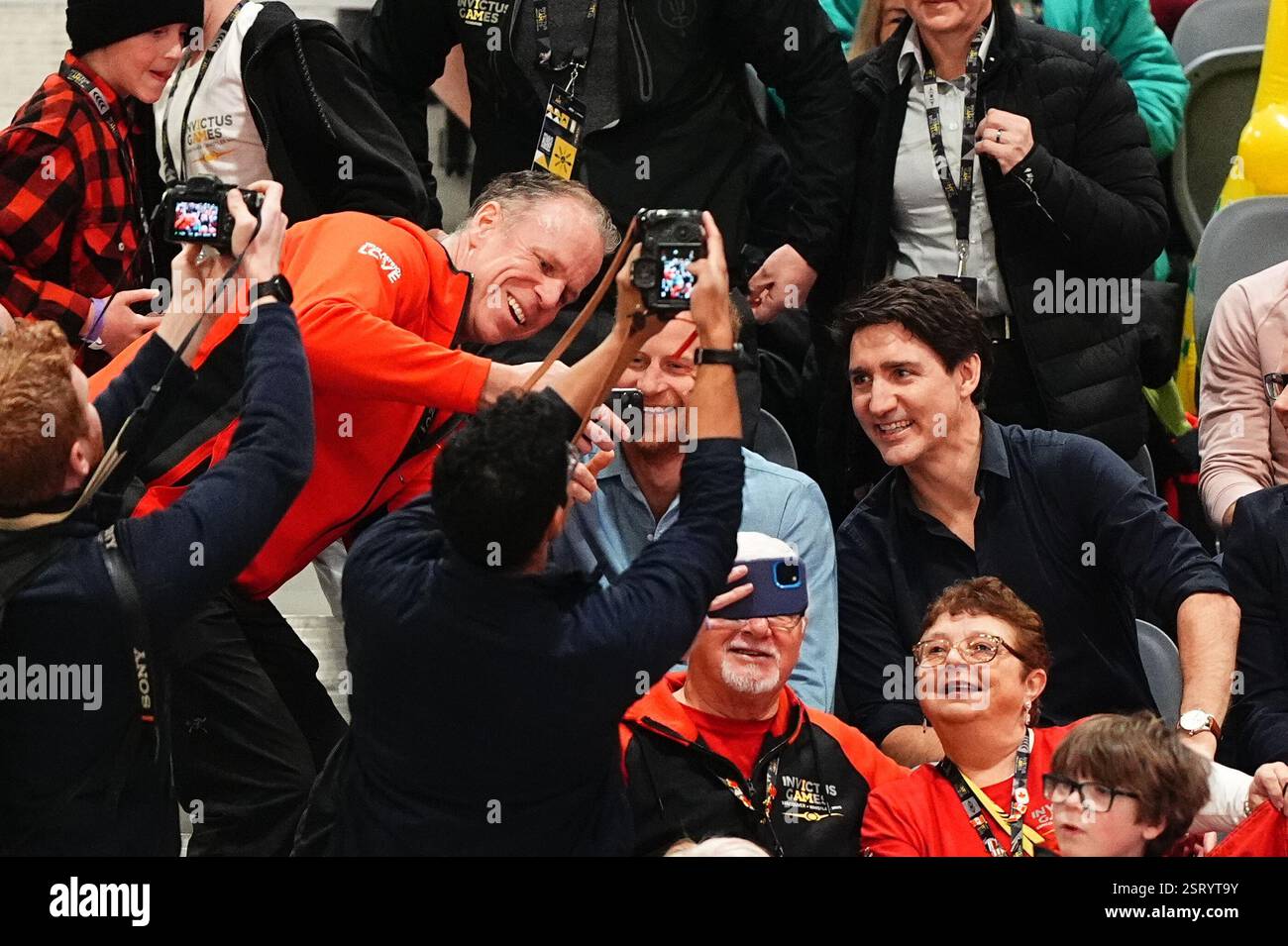 The Duke of Sussex sits with Prime Minister of Canada Justin Trudeau as ...