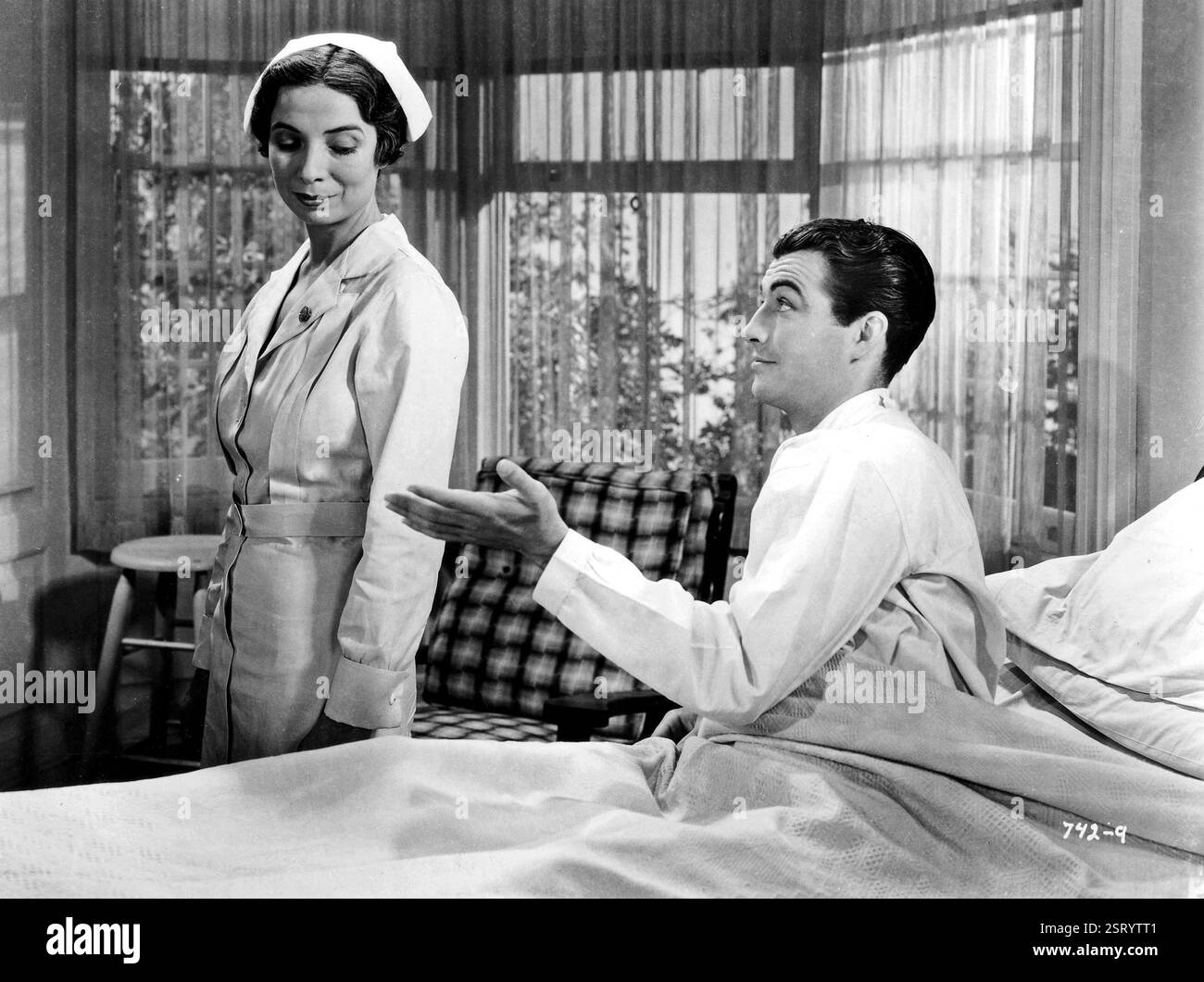 MAGNIFICENT OBSESSION SARA HADEN, ROBERT TAYLOR Date: 1935 Stock Photo ...