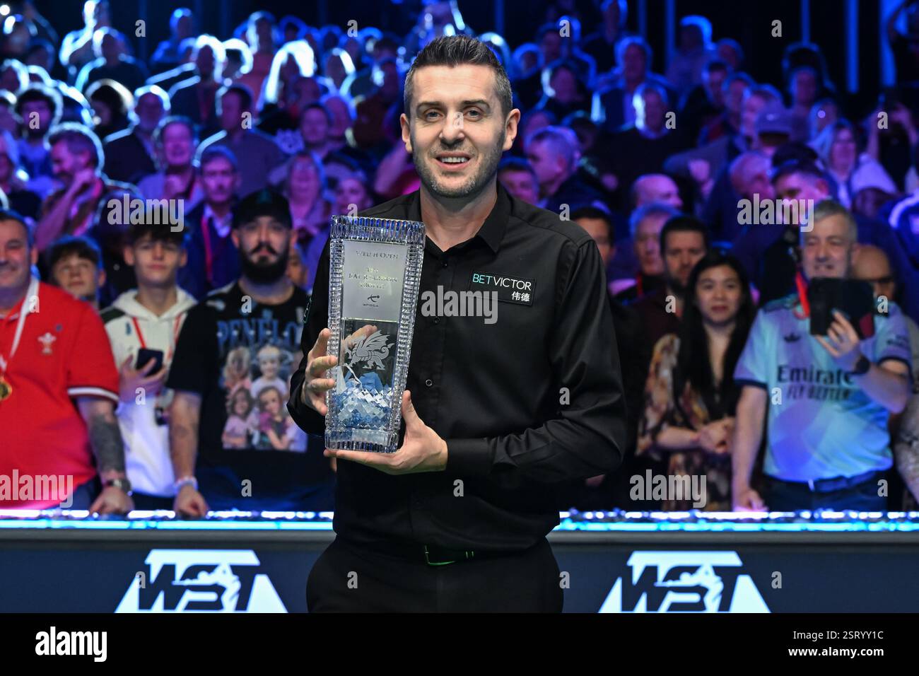 Mark Selby lifts the Ray Reardon Trophy following his victory against ...