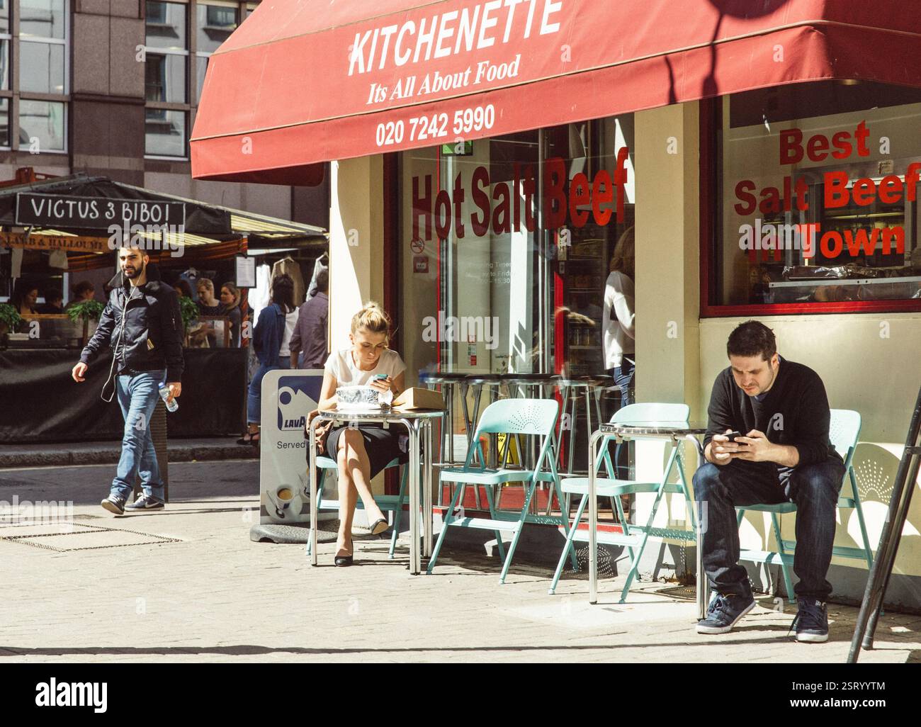 Pedestrians and diners at Kitchenette, a hot salt beef restaurant, on a ...