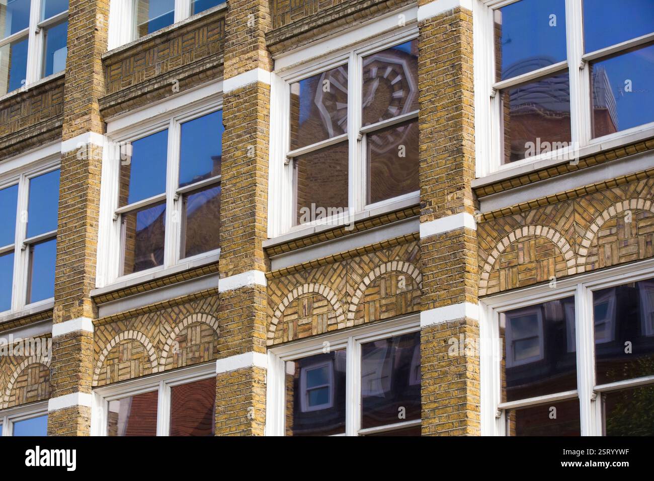 Ornate brickwork and windows of a building on Hatton Garden London ...