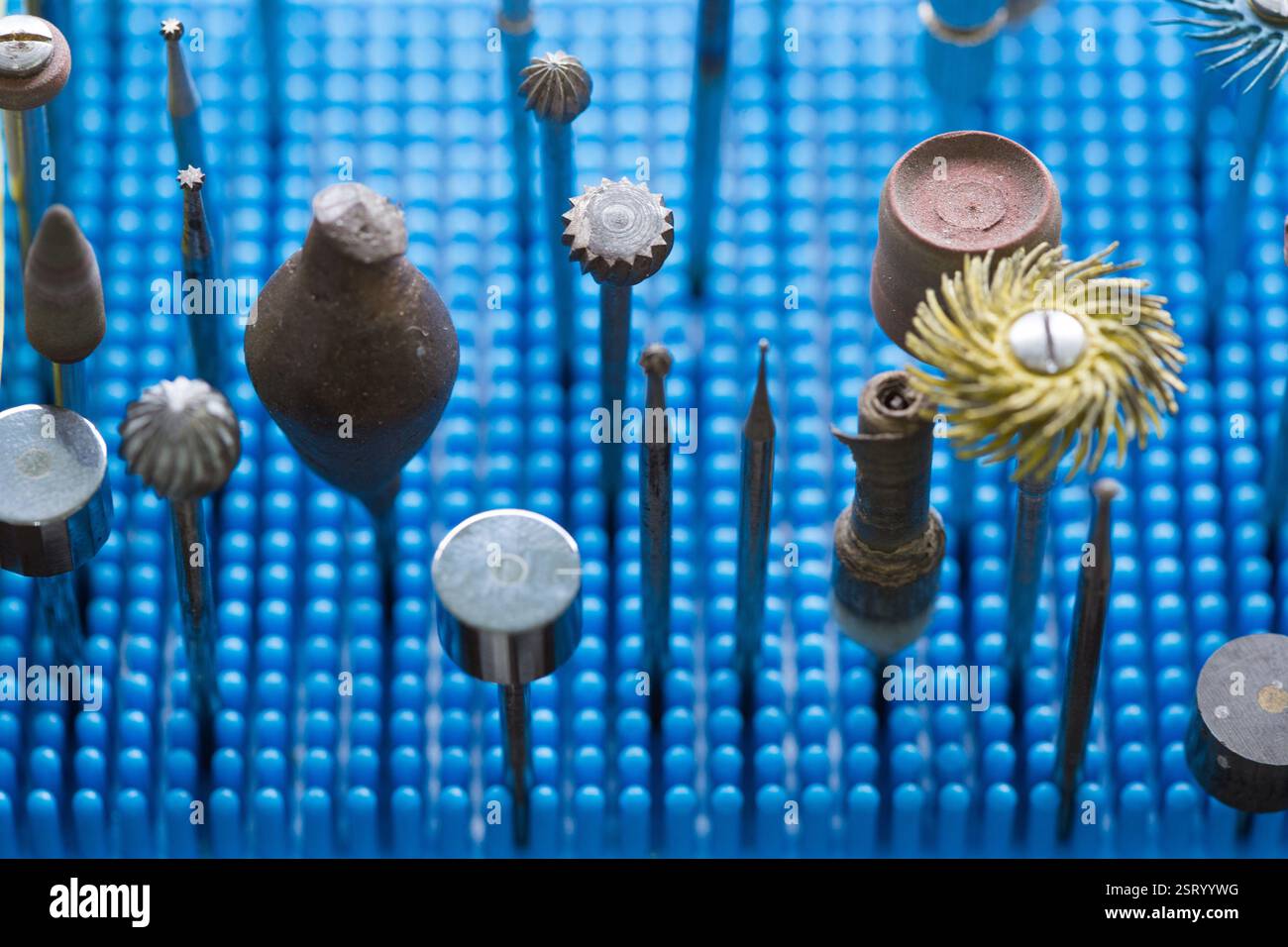 Dental tools, various types, in a blue holder. Likely a dental lab ...