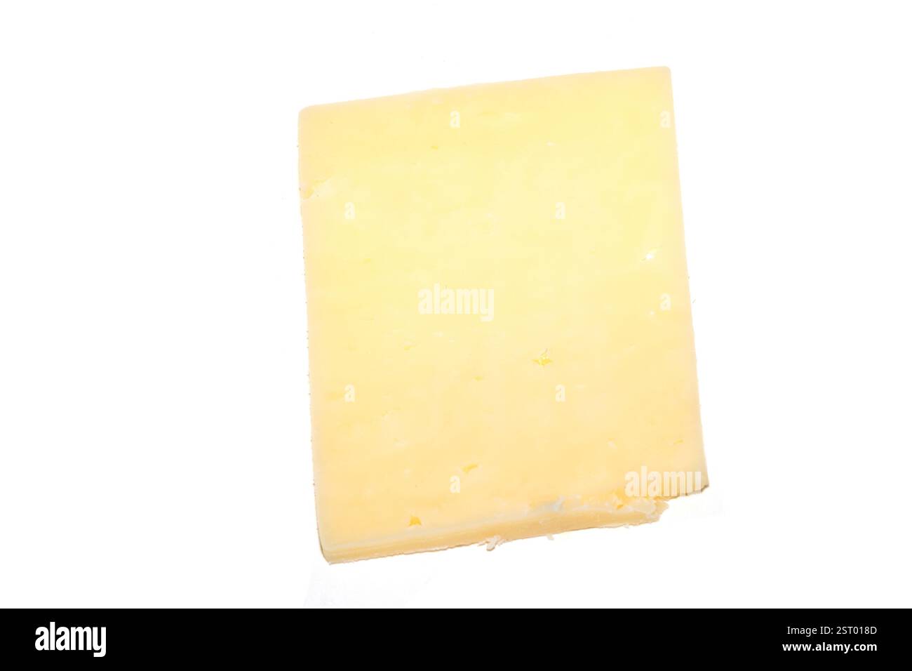 Close up of chedder cheese slices on a white background Stock Photo - Alamy