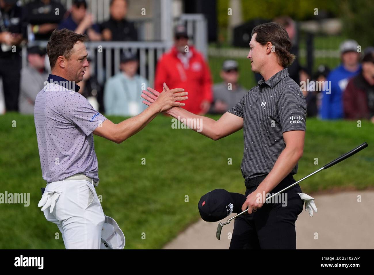 Justin Thomas, left, and Maverick McNealy shake hands after finishing ...
