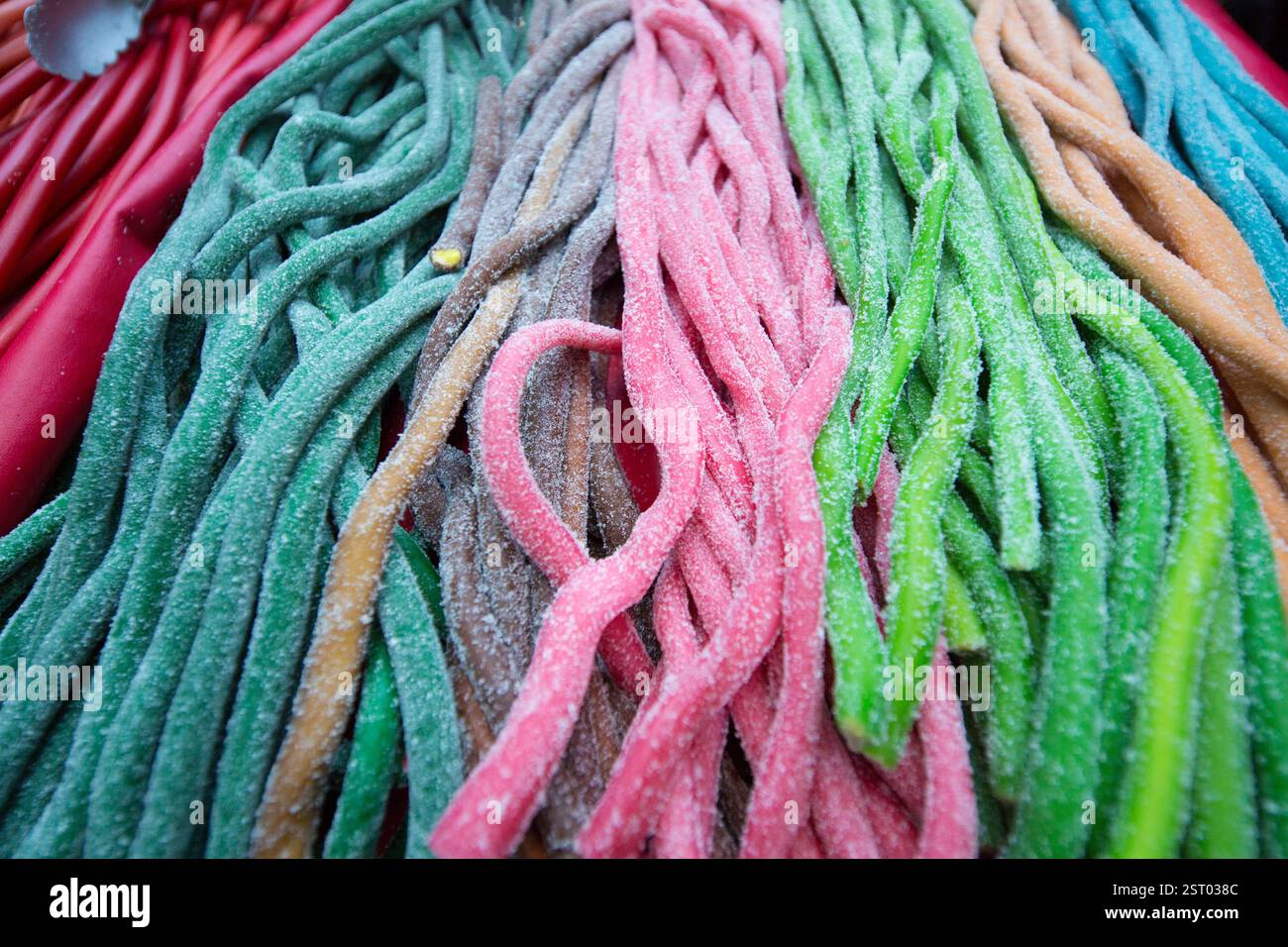 Colorful sugared licorice strands at a market stall Stock Photo - Alamy