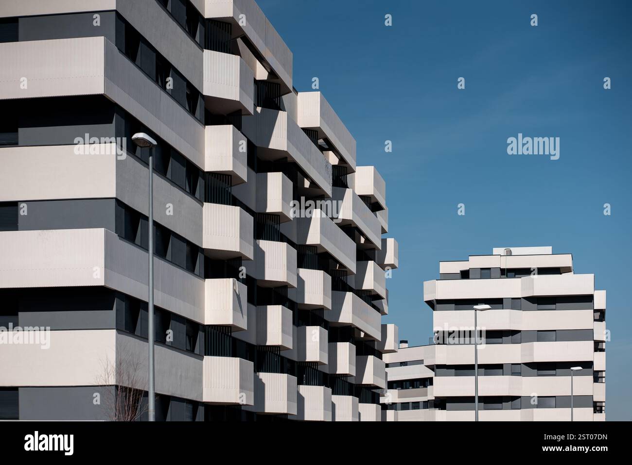 Modern suburb architectural buildings with unique design against clear ...