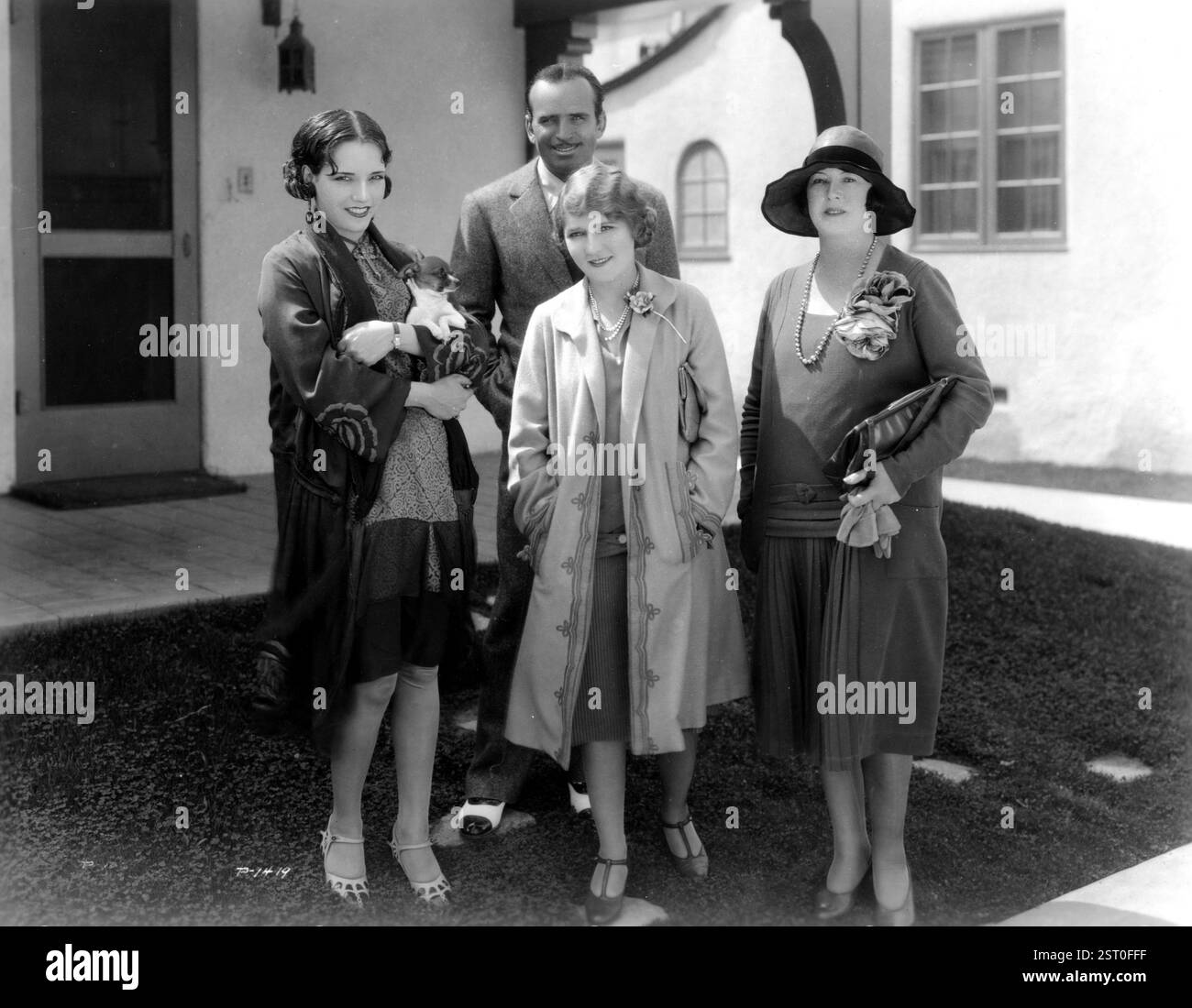 LUPE VELEZ [1908 - 1944] Mexican born Actress[holding a dog, left] MARY ...