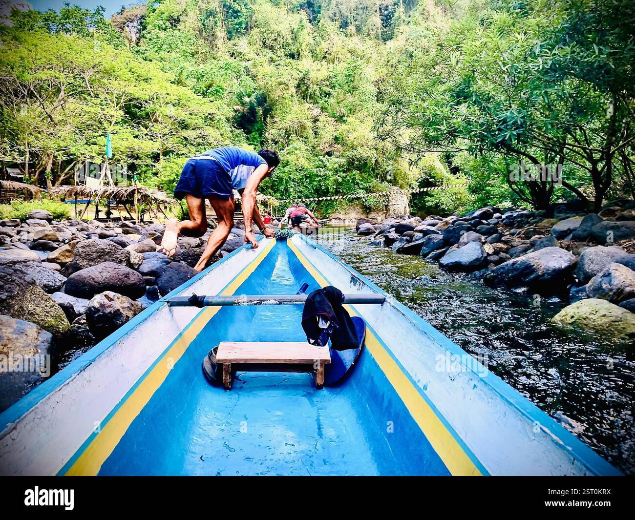 boatman pulling his boat upstream river Stock Photo - Alamy