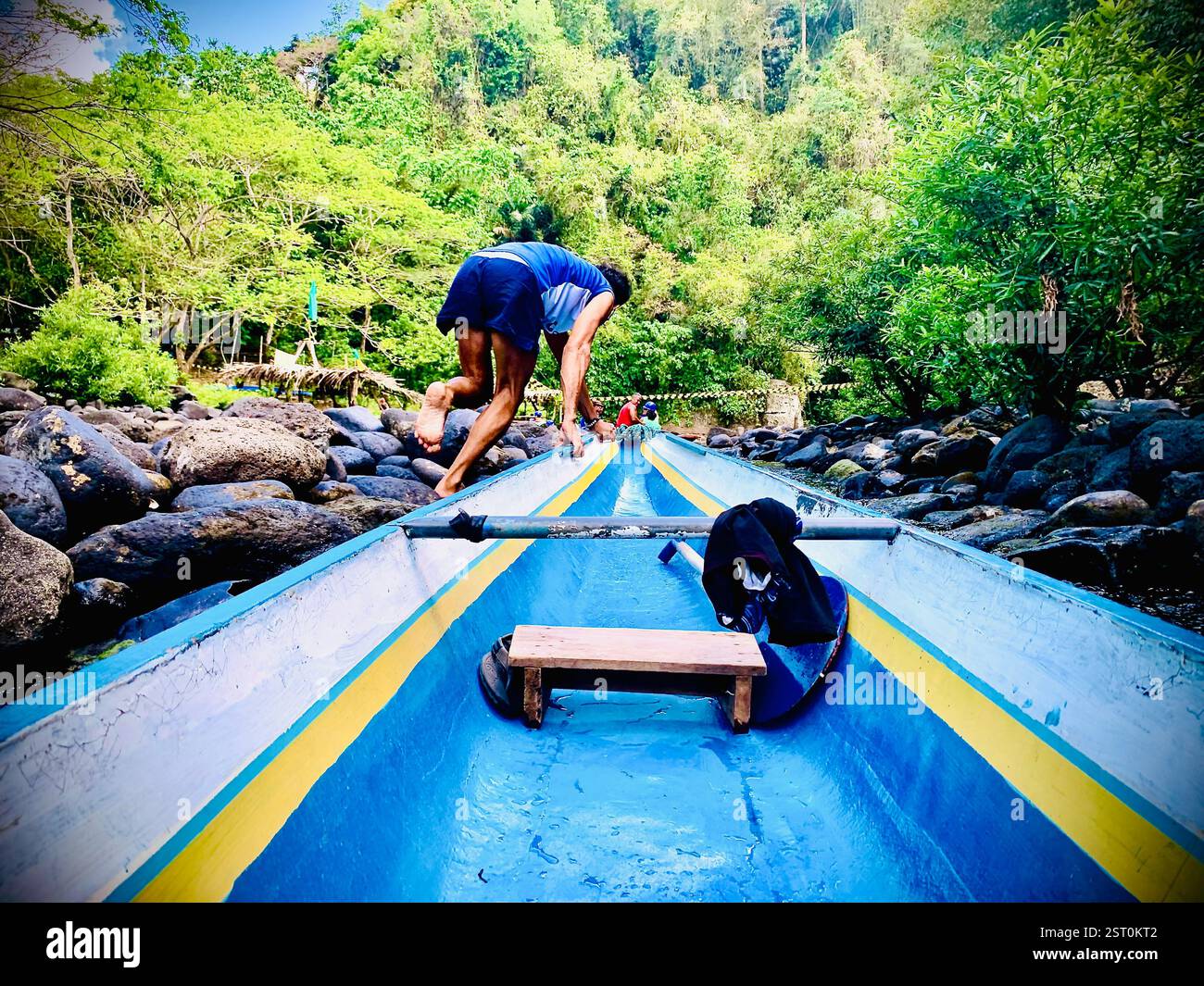 boatman pulling his boat upstream river Stock Photo - Alamy