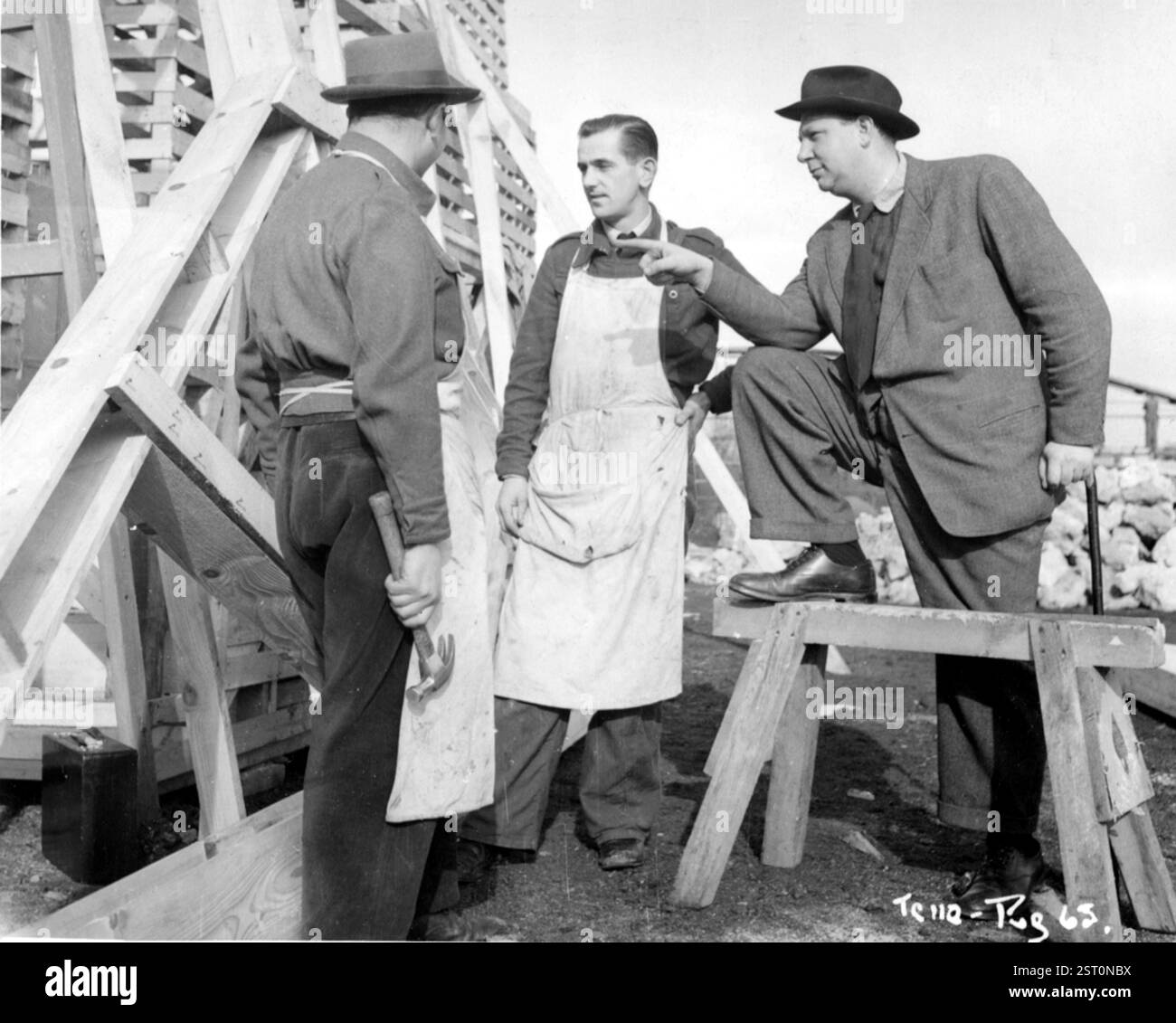 HUNGRY HILL [BR 1947] Actor CECIL PARKER [right] with workmen ...