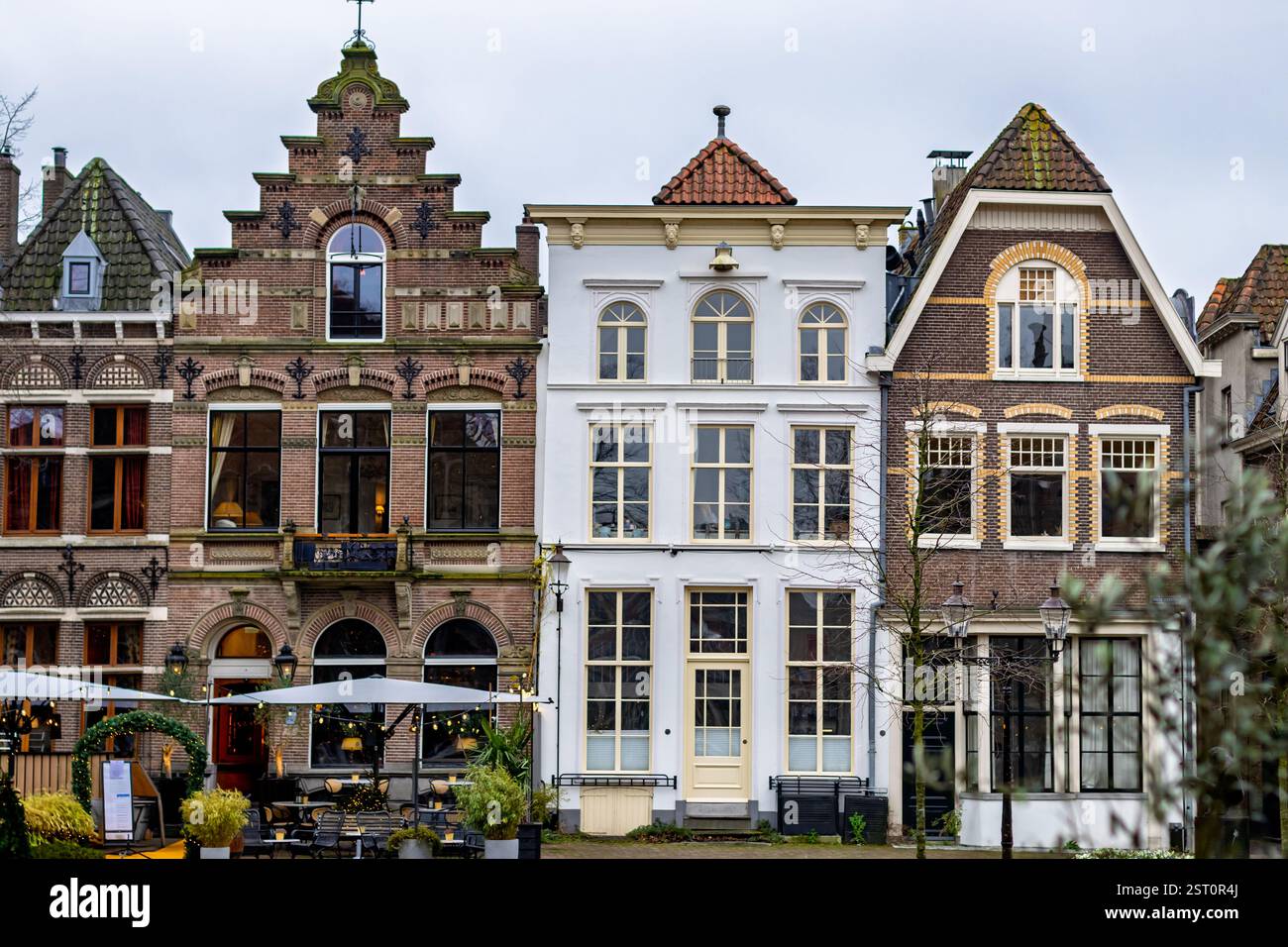 An iconic view of traditional Dutch facades by the canal in Amsterdam ...