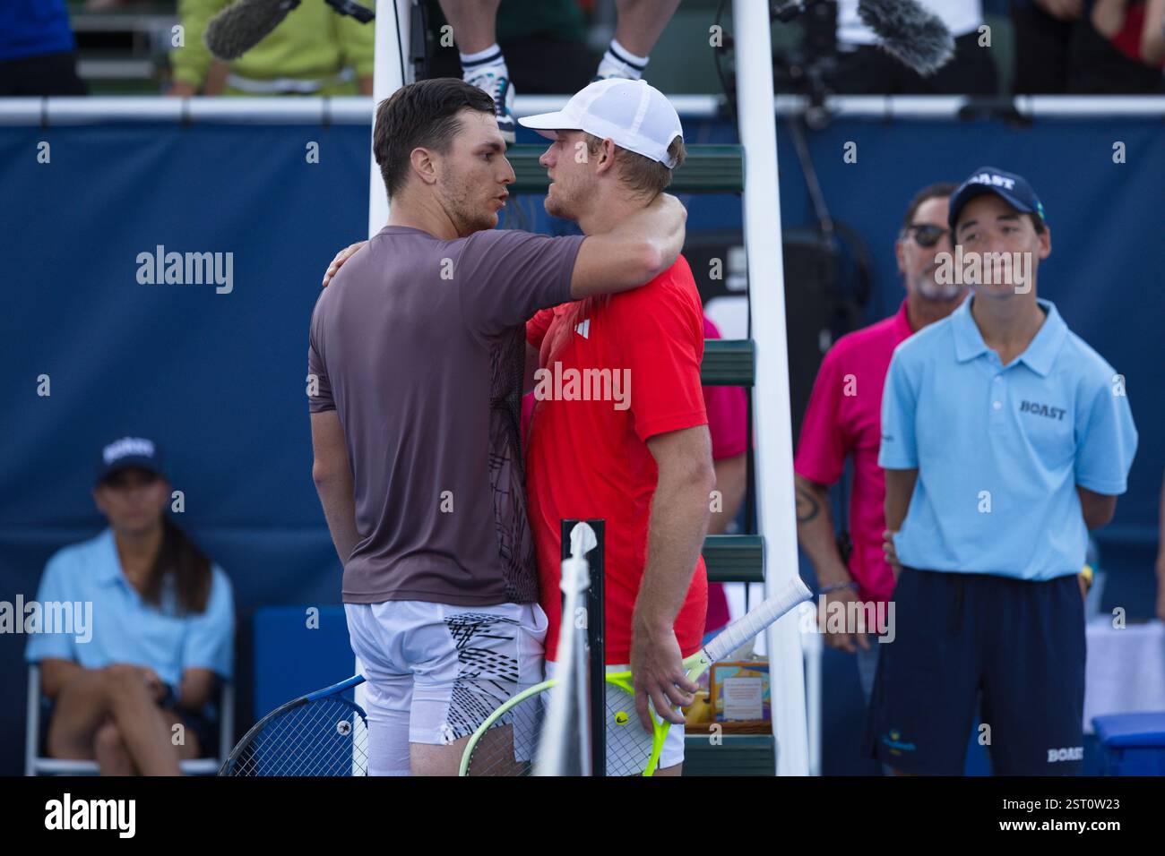 DELRAY BEACH, FLORIDA - FEBRUARY 16: Miomir Kecmanovic of Serbia meet at net with Alejandro ...