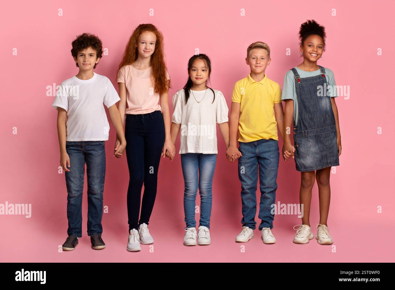 School friendship. Adorable multiethnic children holding hands together ...