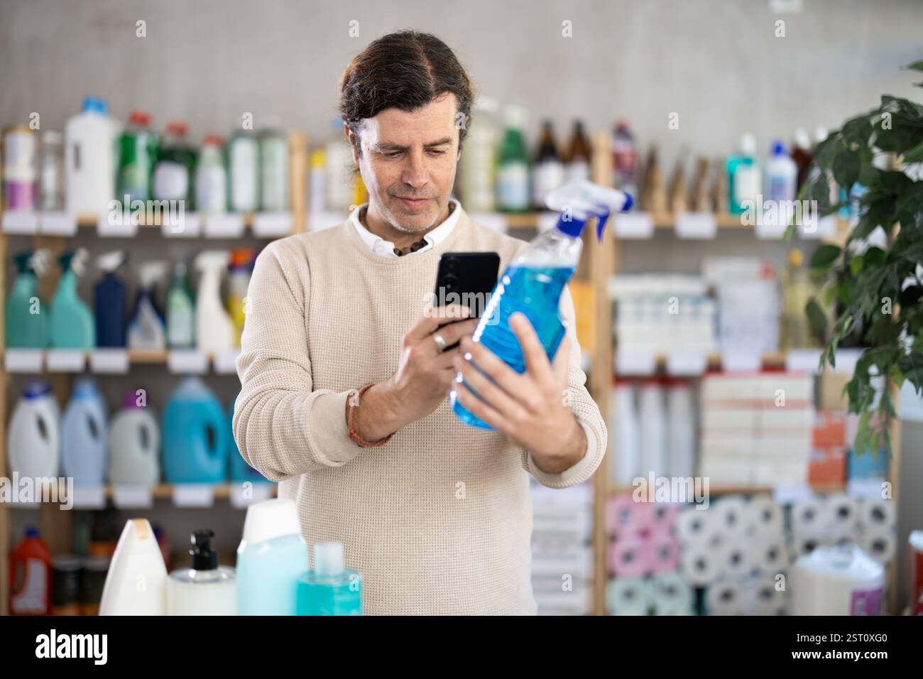 Checking expiration date of spray glass cleaner for windows - male ...