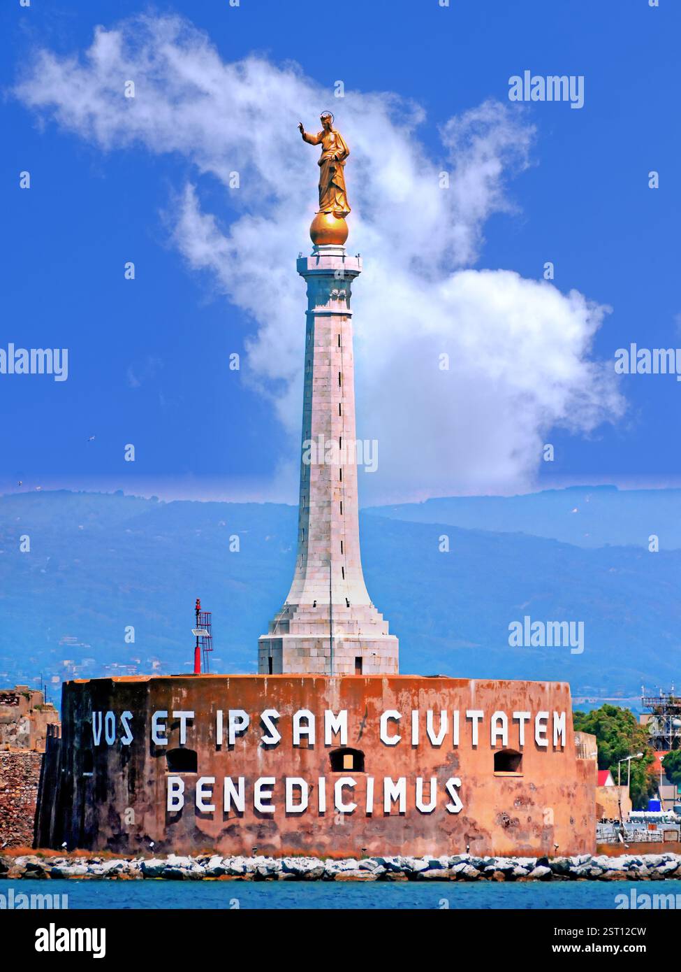 Messina harbour entrance with statue of the golden Madonna against blue ...