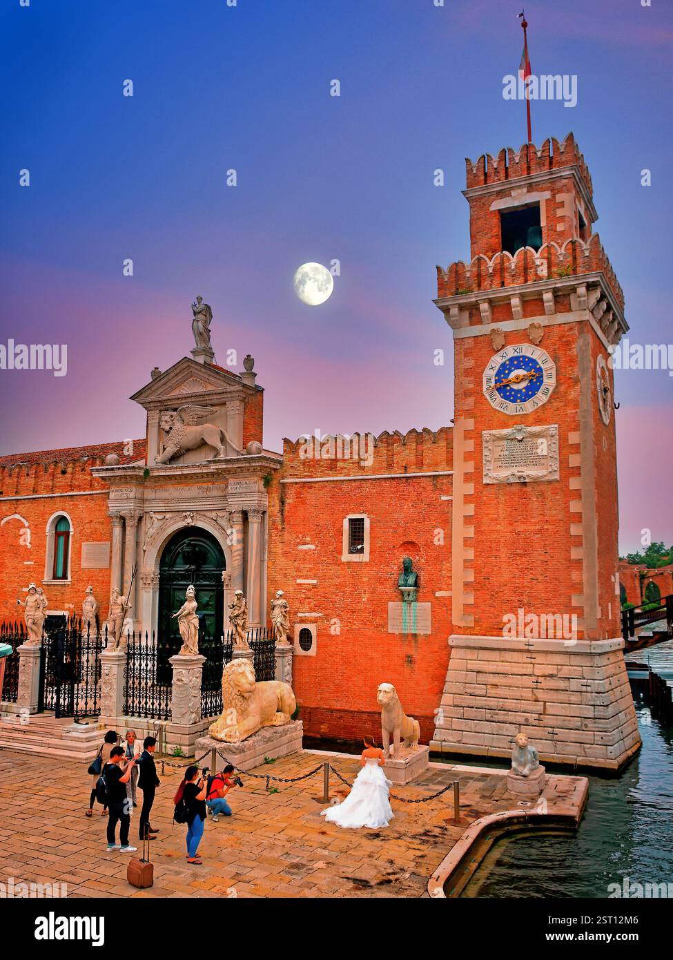 Venice Arsenal clock tower and bells with fashion show wedding in full ...