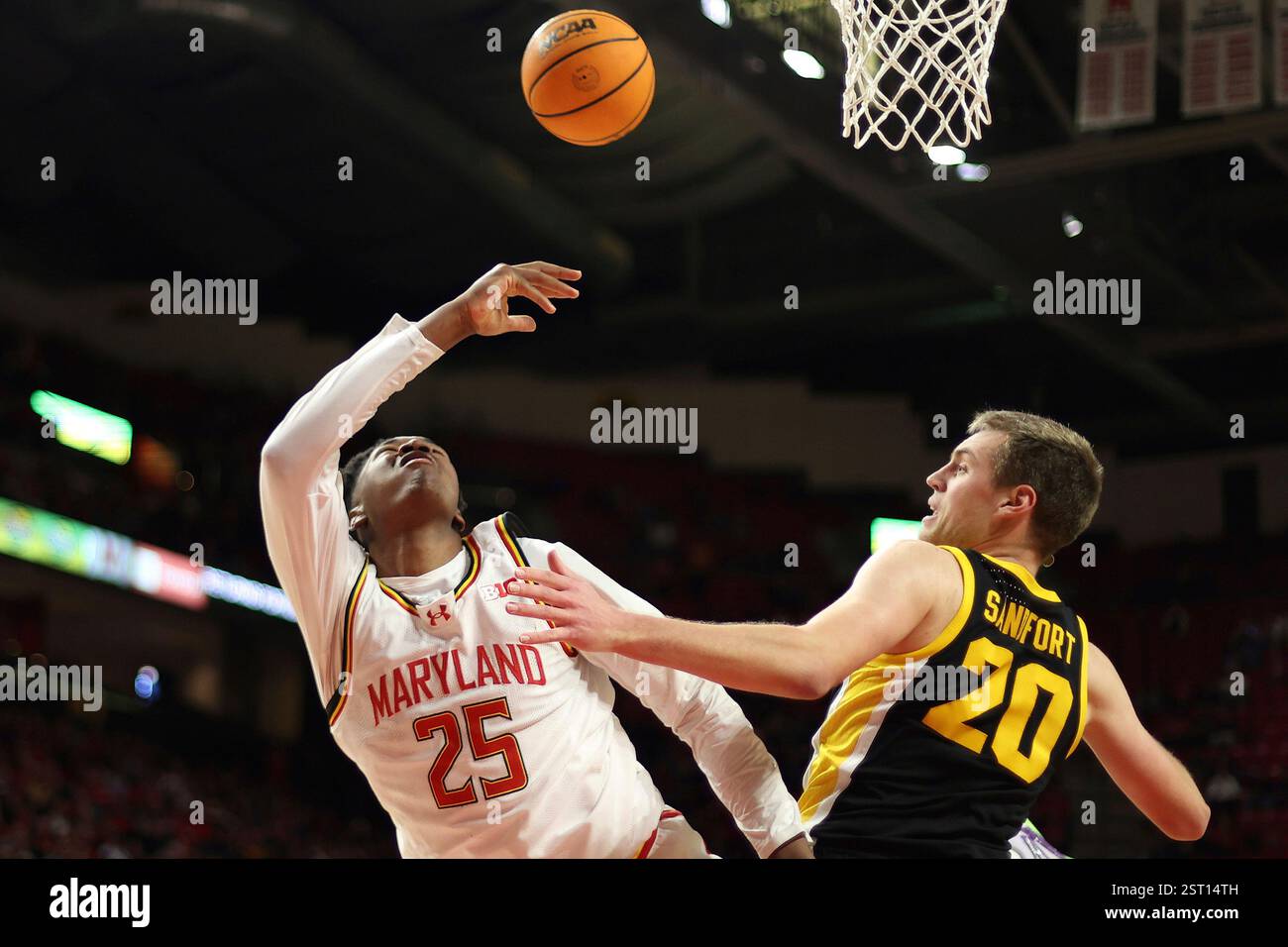 Maryland center Derik Queen (25) takes a shot over Iowa forward Payton ...