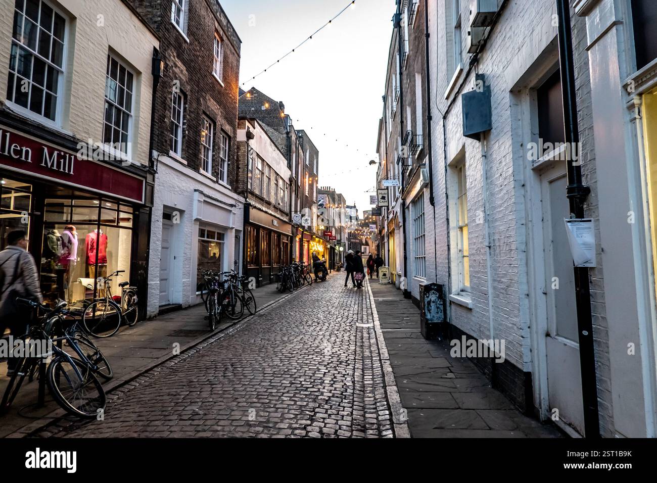 A street view in Cambridge, England, features cobblestone streets ...