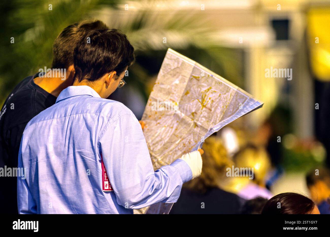 2 male tourists looking at touring map, Munich, Upper Bavaria, Germany ...