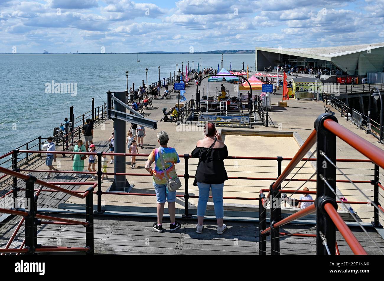 Two women on the steps to the sun deck at the Pier Head on the longest ...