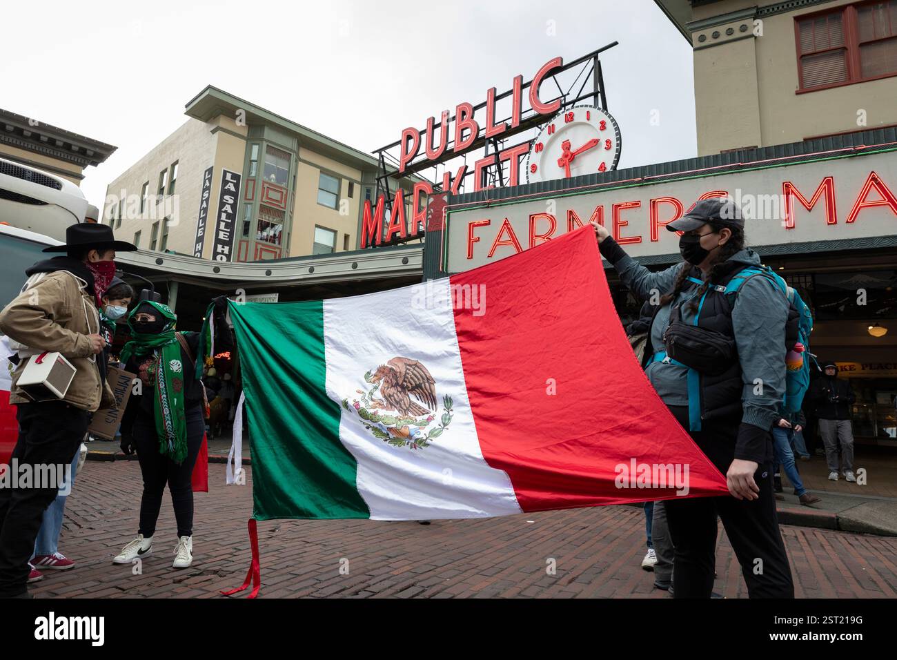Seattle, Washington, USA. 16th February 2025. Protesters unfurl a large ...