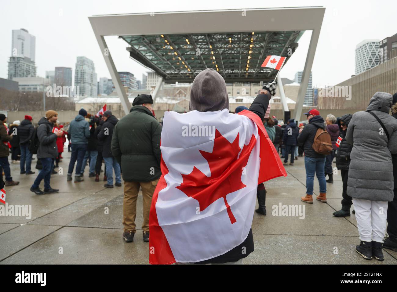 Toronto, Canada.15th February 2025. A local resident draped in Canadian ...