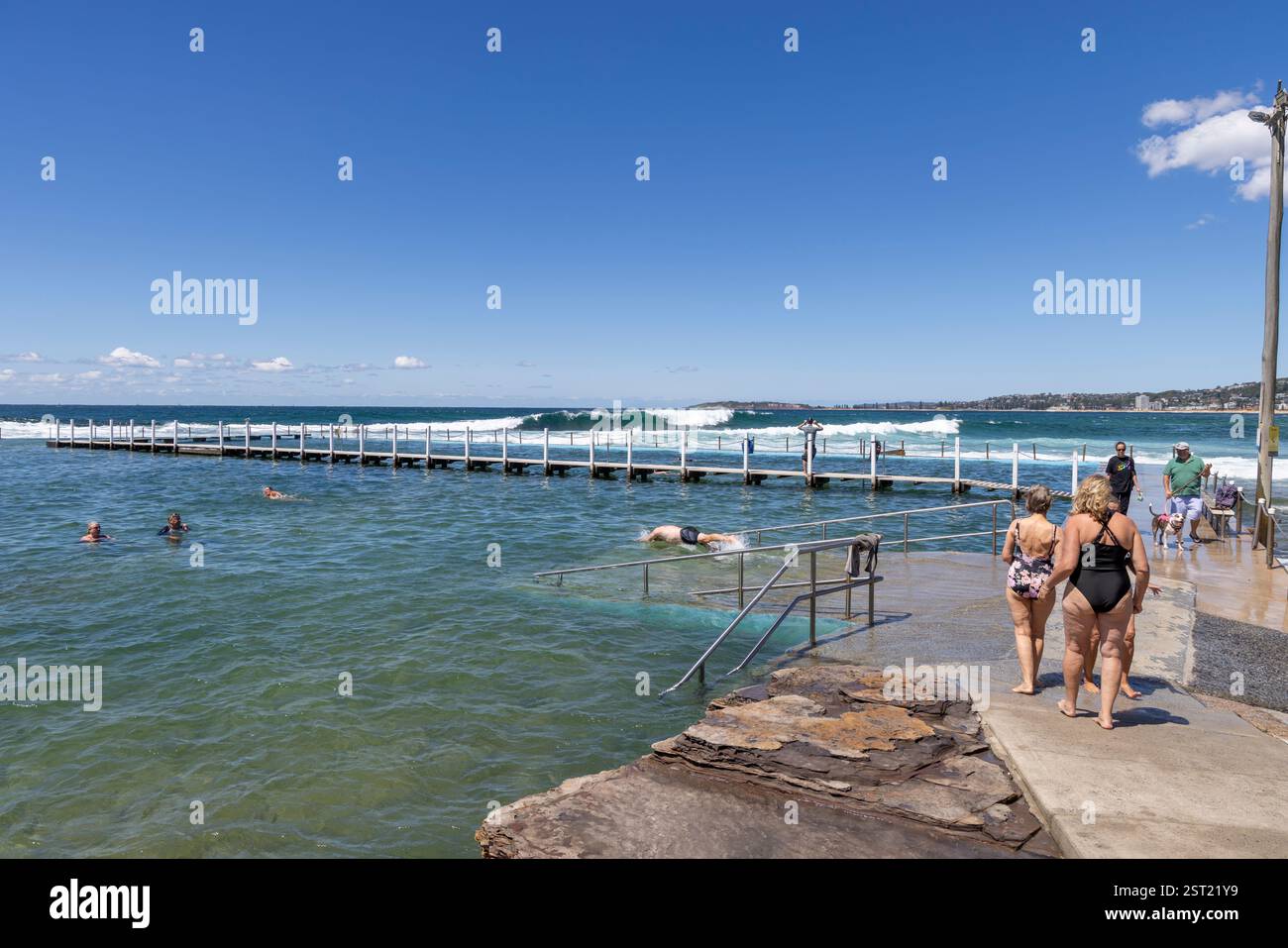 Narrabeen beach ocean rockpool , women and other people swimming in ...