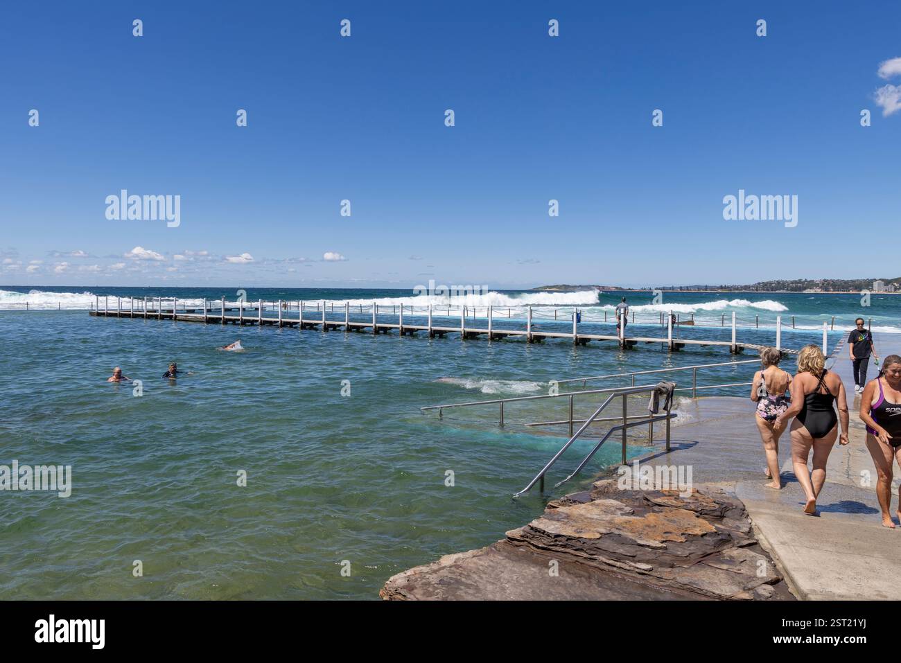 Narrabeen beach ocean rockpool , women and other people swimming in ...