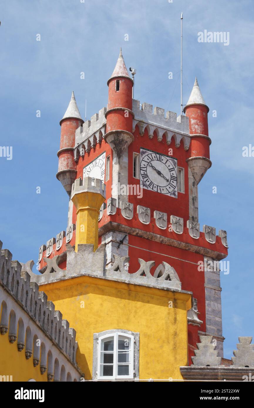 Pena Palace clock tower, Sintra, Portugal. A vibrant red and yellow ...