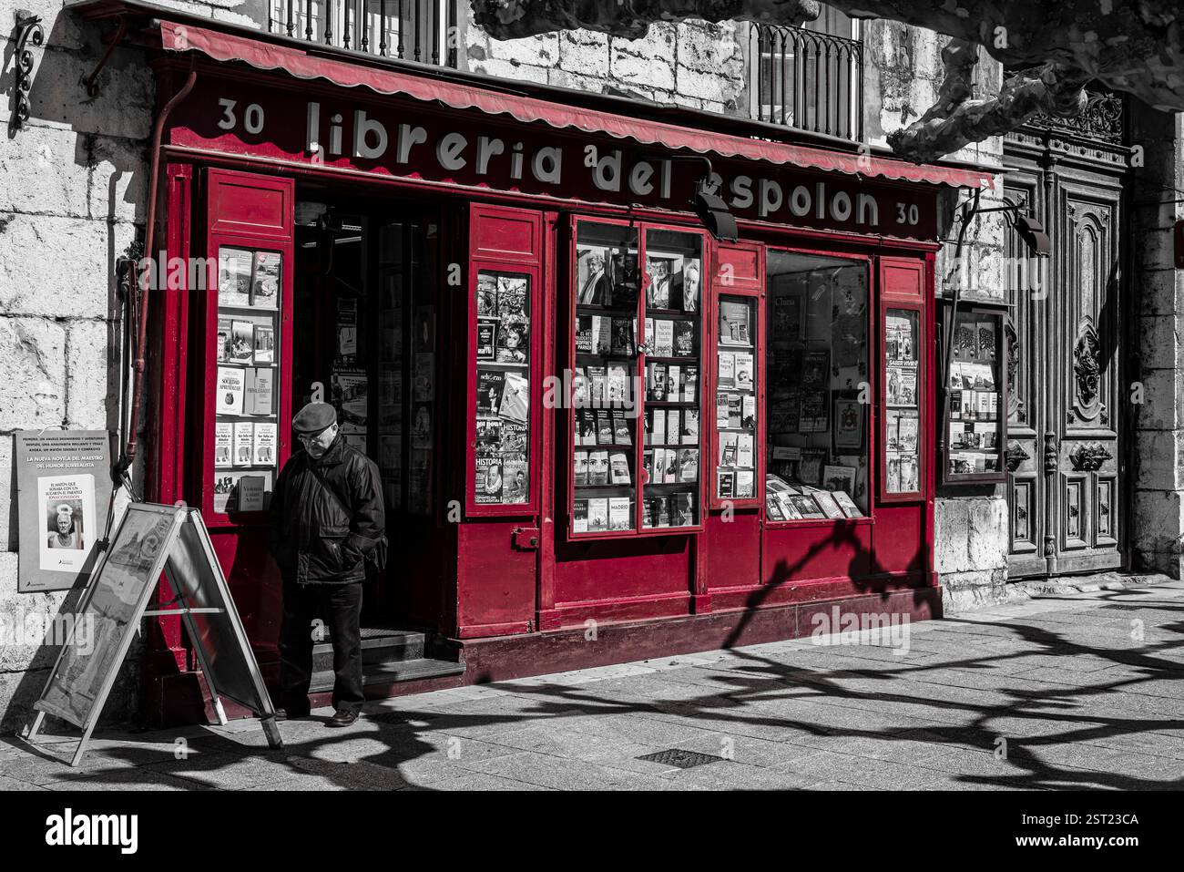 Vintage Bookstore Facade Highlighted in Red With Passing Pedestrian ...