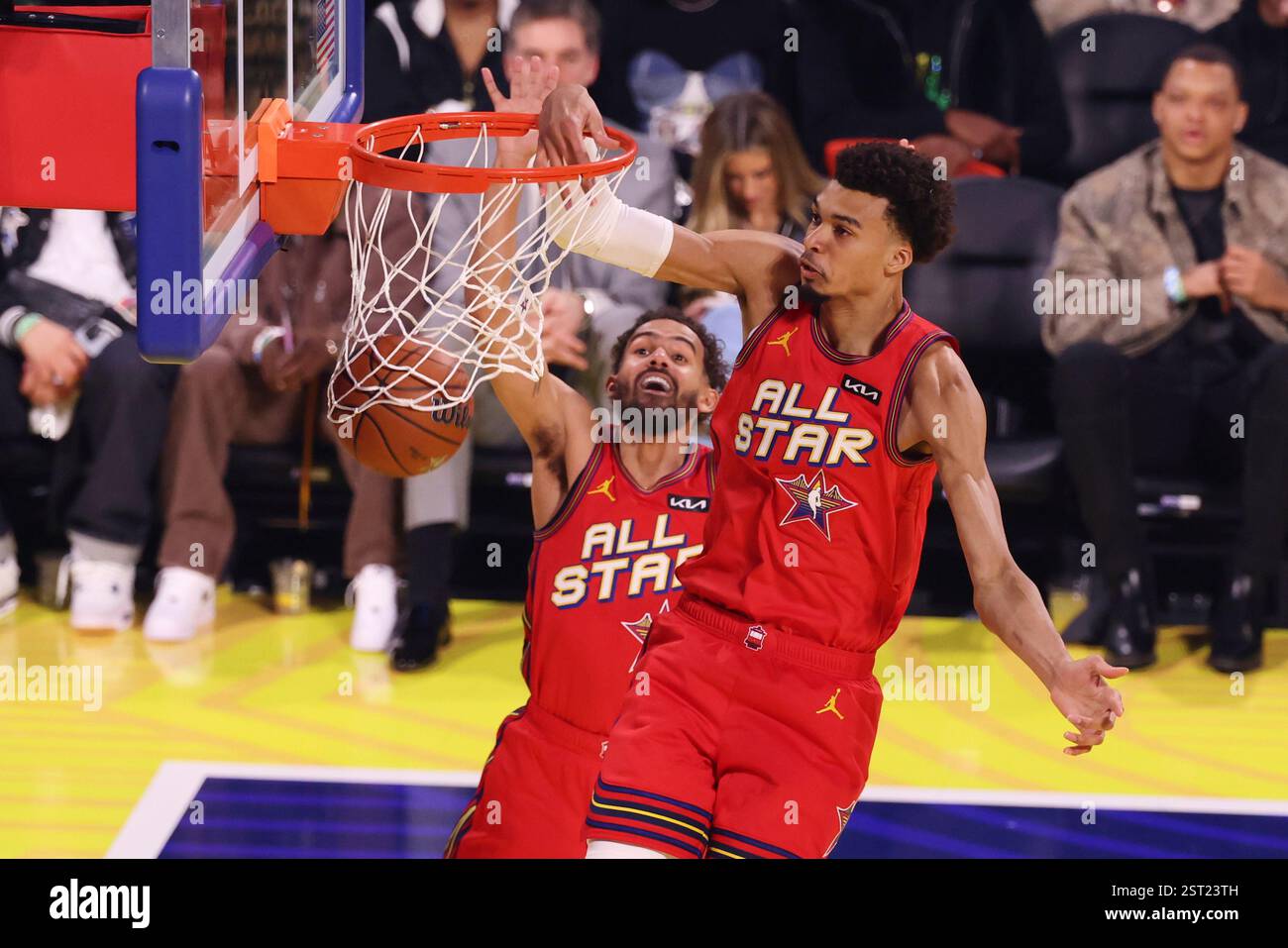 San Antonio Spurs center Victor Wembanyama dunks past teammate Trae ...