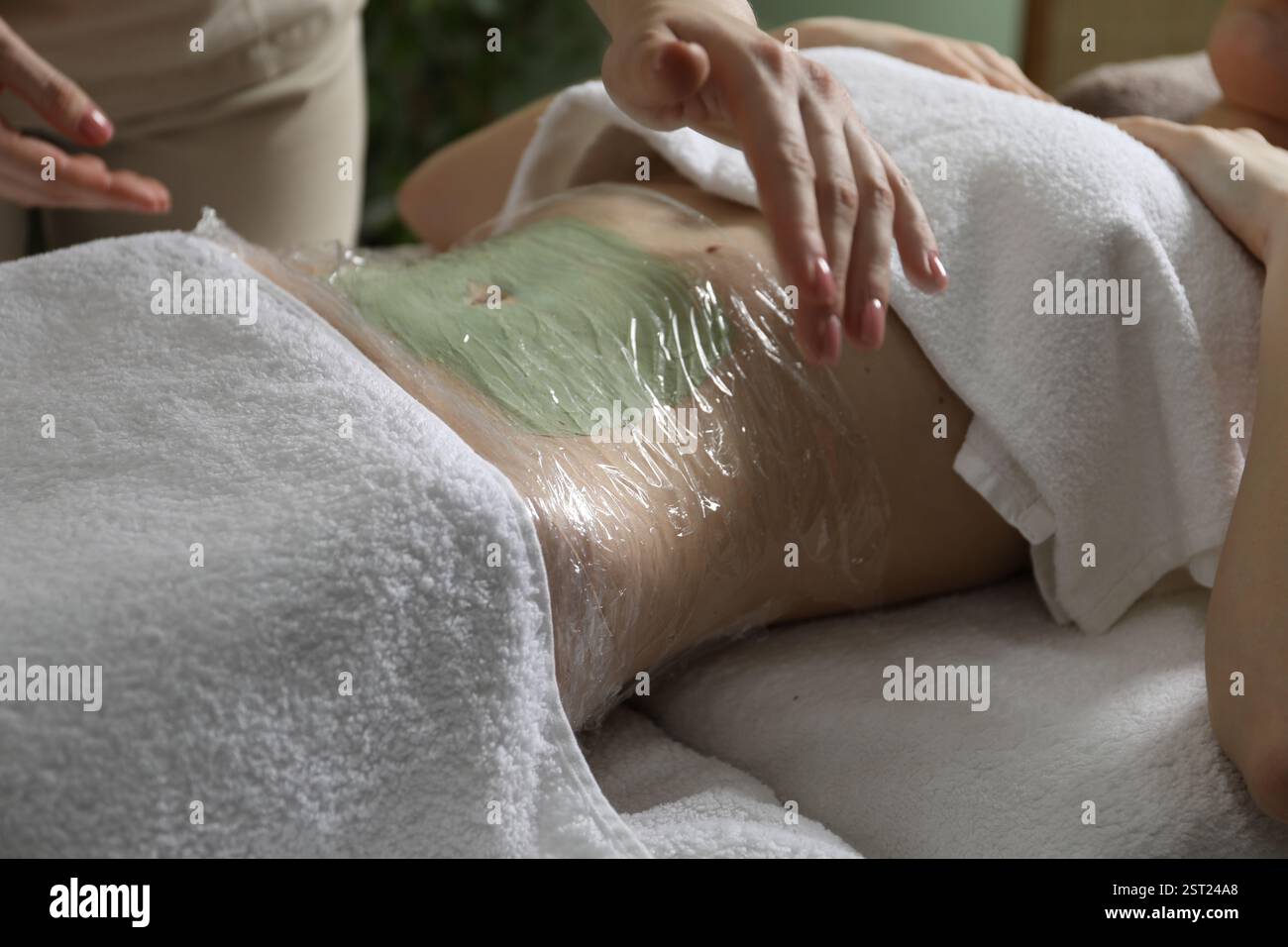 Woman undergoing body wraps treatment in spa salon, closeup Stock Photo - Alamy