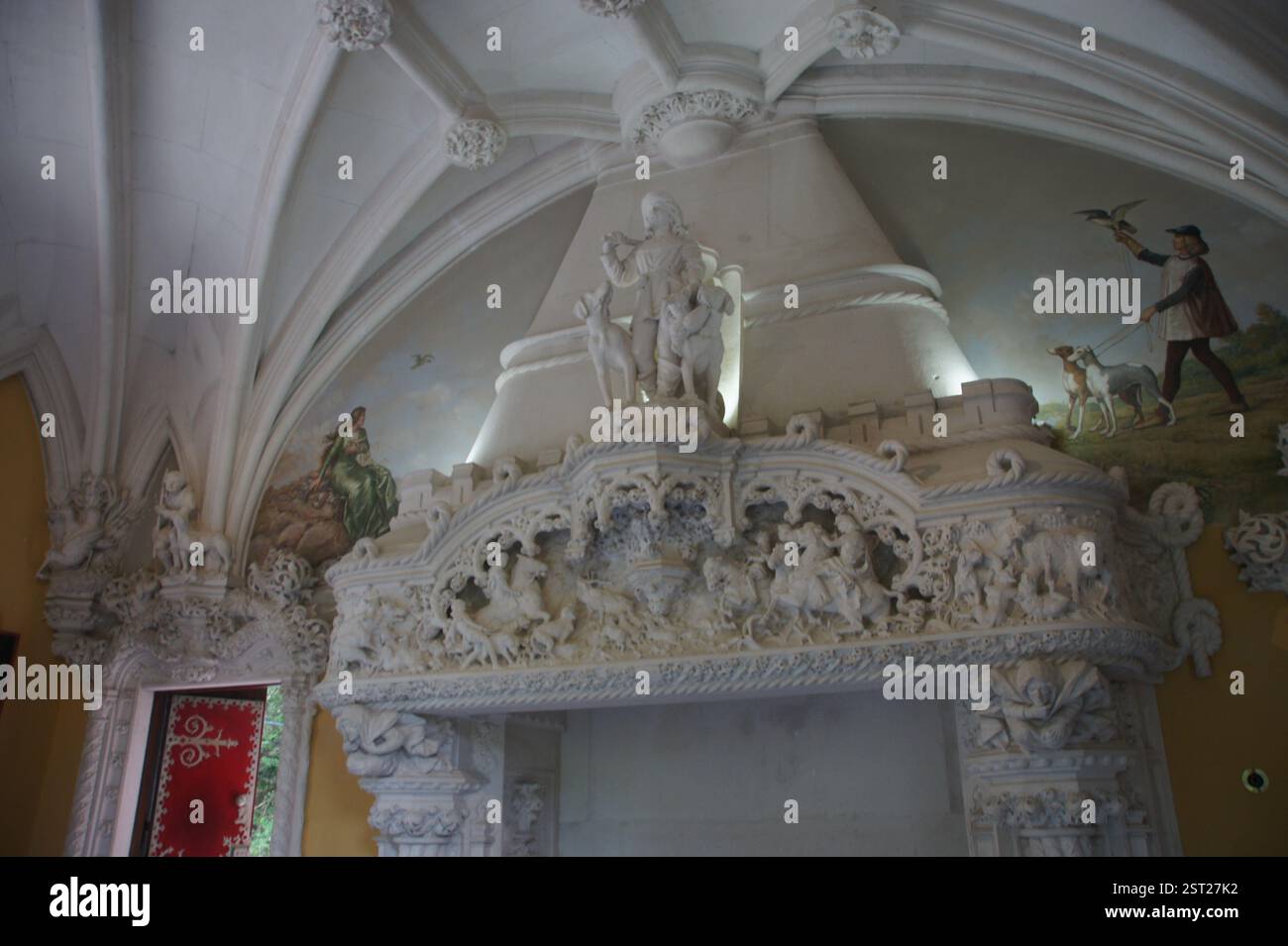 Ornate stone well, Sintra, Portugal. Spiral staircase descends into ...
