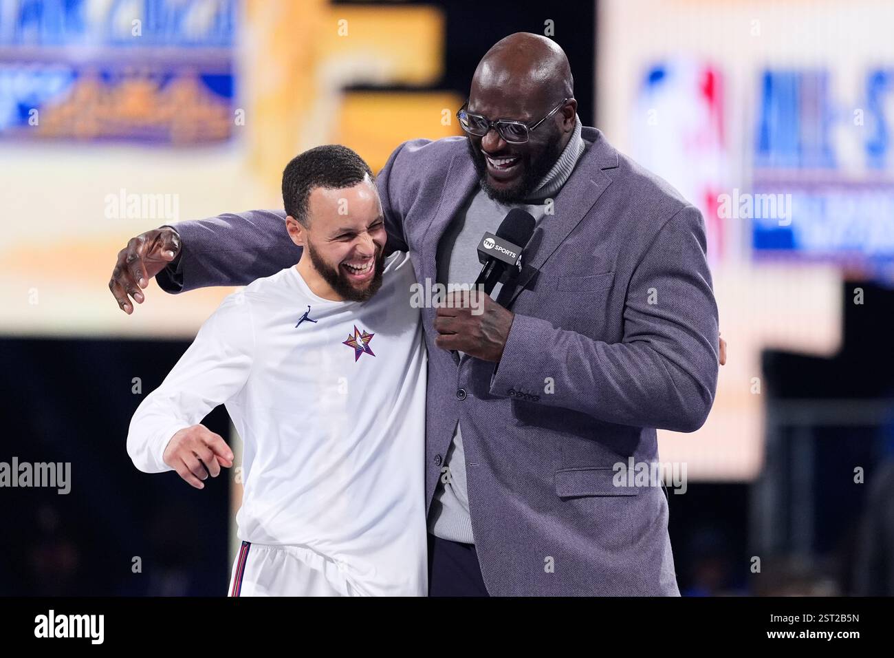 Golden State Warriors guard Stephen Curry, left, talks to Shaq's OGs coach Shaquille O'Neal ...