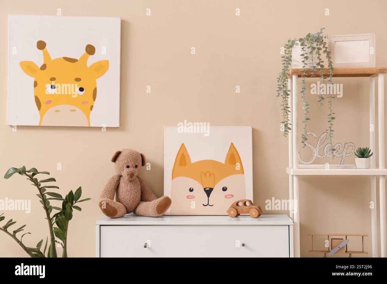 Interior of nursery with commode, shelf unit and pictures Stock Photo ...