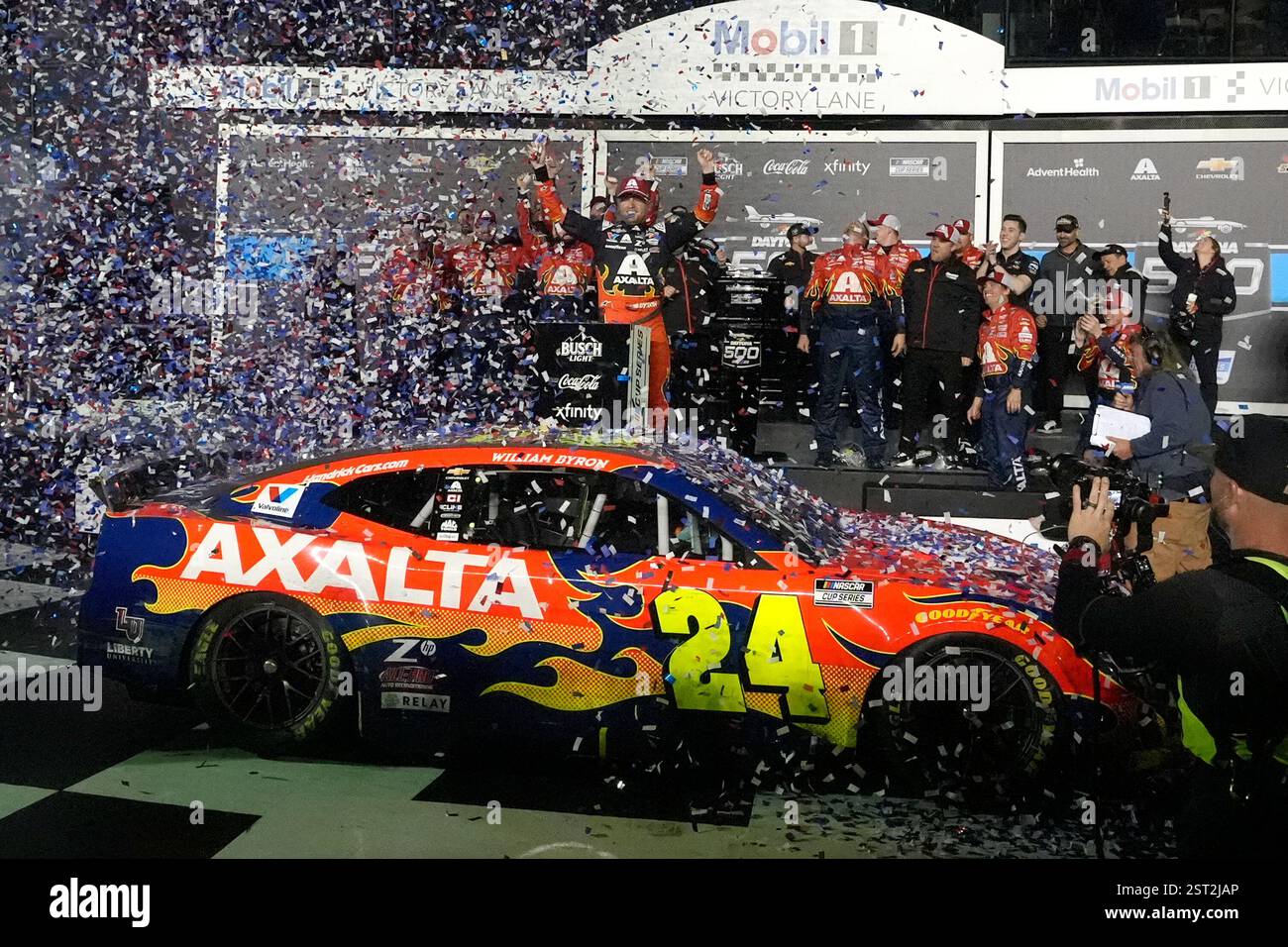 William Byron celebrates with his crew in Victory Lane after winning ...