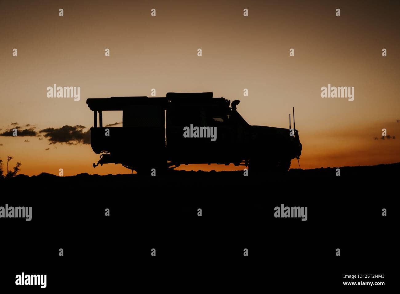 Toyota 79 Series LandCruiser silhouetted at sunset on a four wheel ...