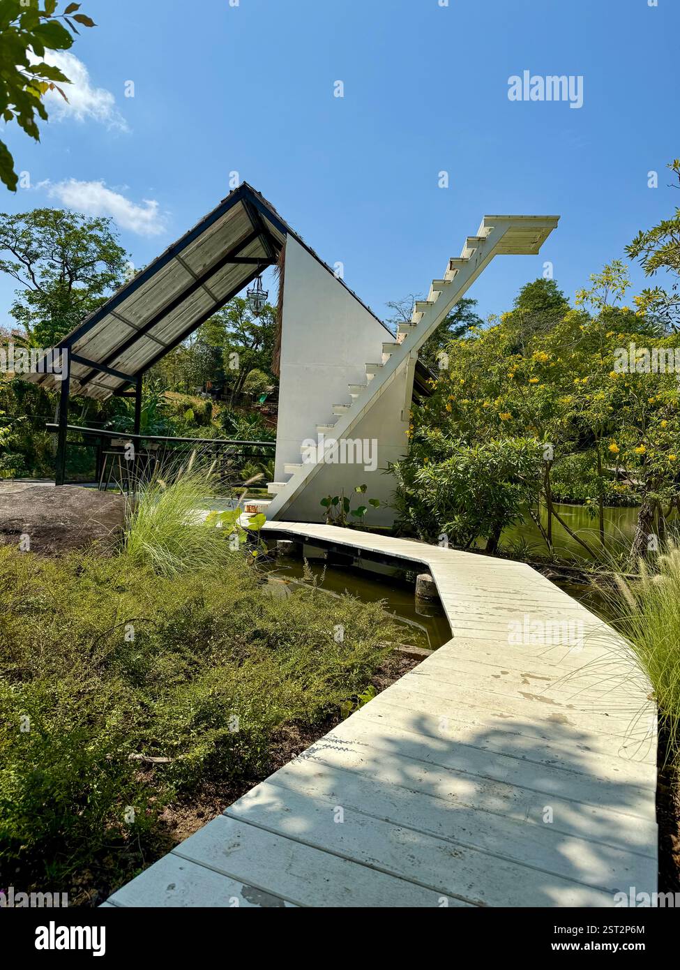 Modern Stilt House by a Tranquil Pond2 A contemporary small house with ...