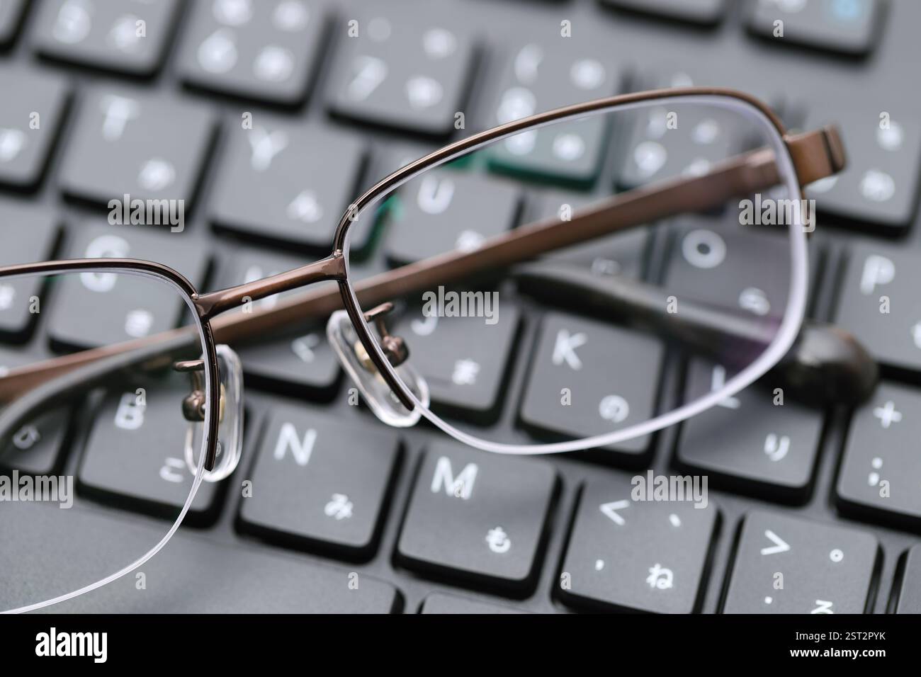 Stylish eyesight glasses on computer keyboard Stock Photo - Alamy