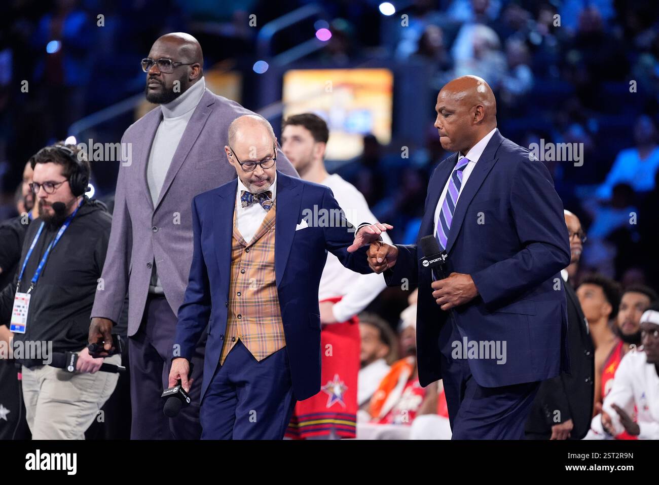 Shaquille O'Neal, Ernie Johnson and Charles Barkley stand at mid-court to be honored during the ...