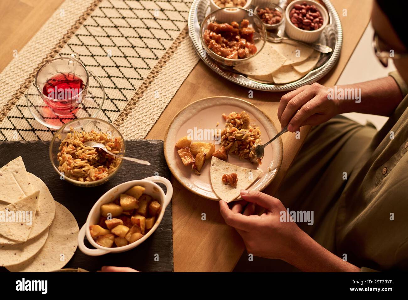 Enjoying authentic Mexican cuisine at cozy dinner table, featuring ...