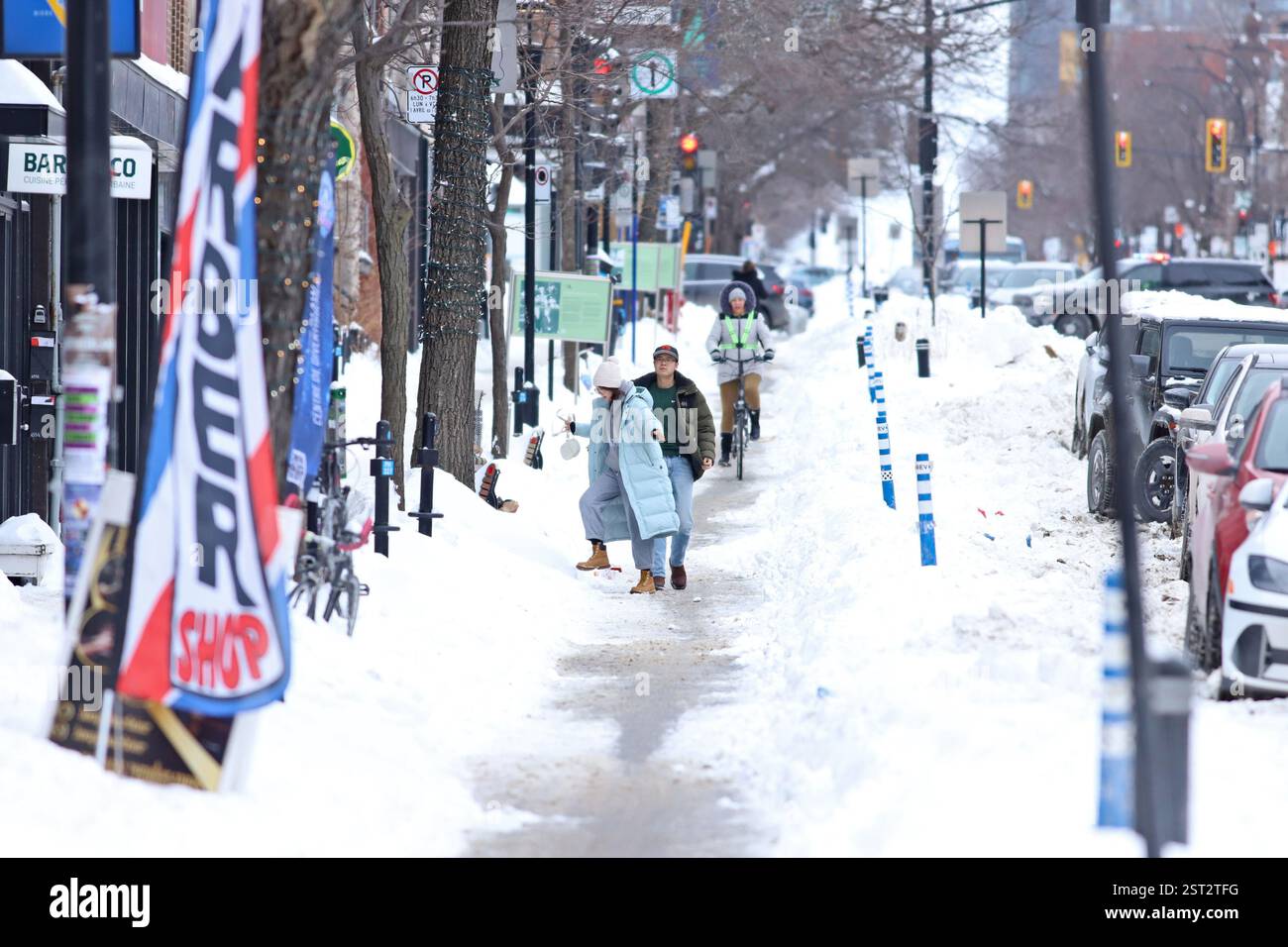 Montreal, Canada. 15th Feb, 2025. A couple are seen during the snowstorm. The province of Quebec ...