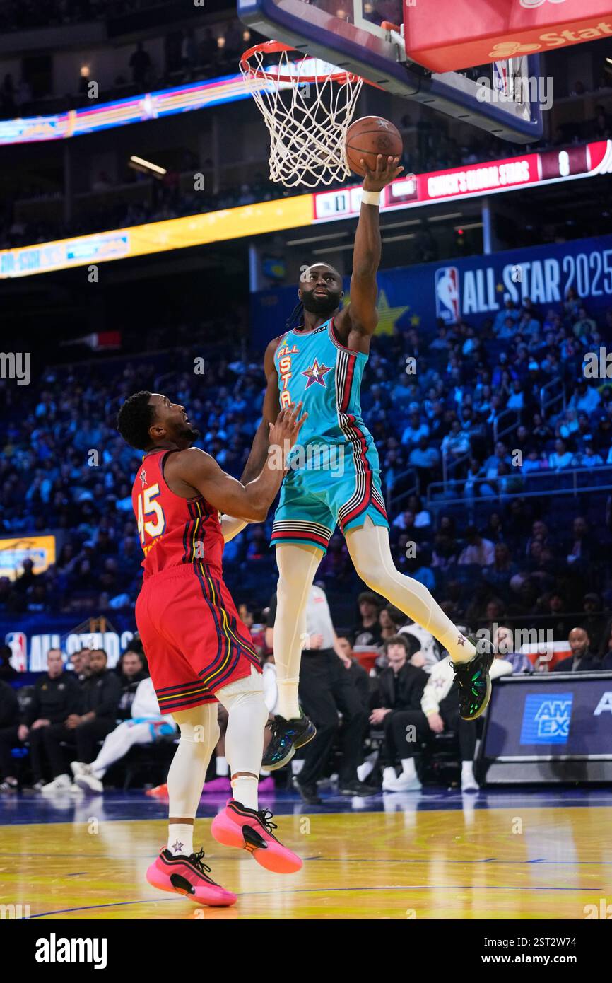 Boston Celtics guard Jaylen Brown drives past Cleveland Cavaliers guard ...