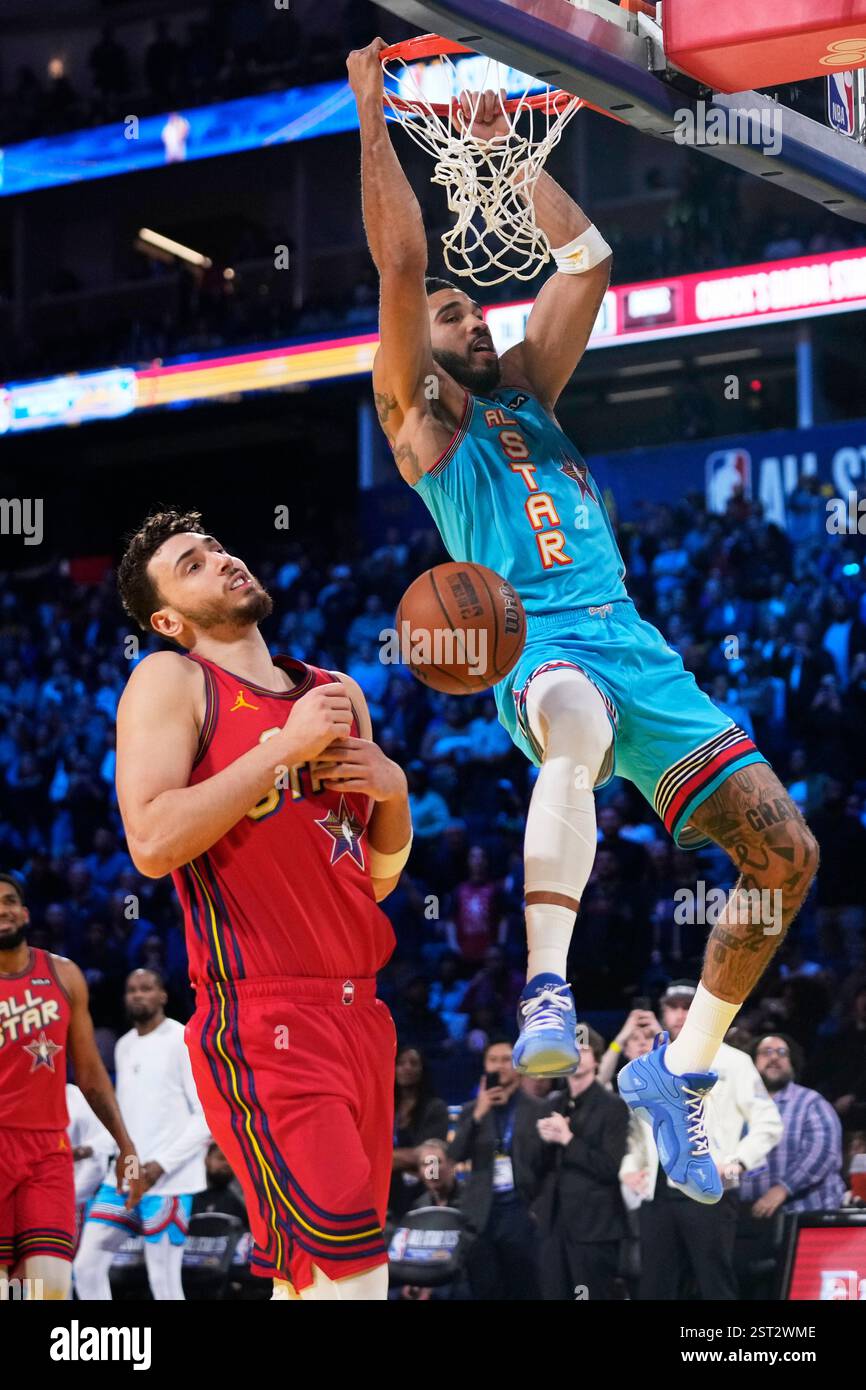 Boston Celtics guard Jayson Tatum dunks past Houston Rockets center ...
